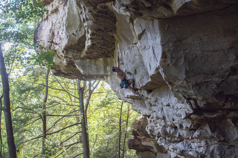 Chris Tableing executing the fingerlock crux of Twilight (13c). Climber ...