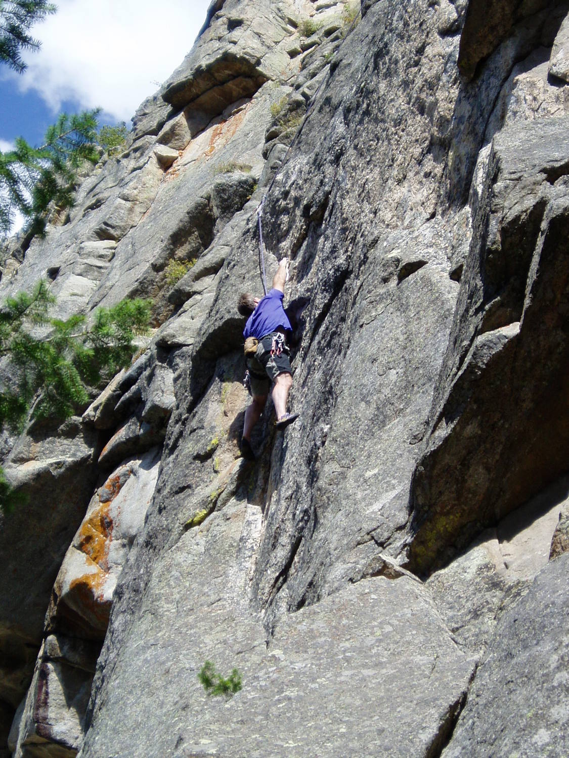 Unclipping the second bolt on the crux headwall (third bolt overall ...