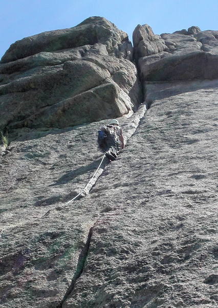 Mike Borkowski working up the flared crack on the second pitch.