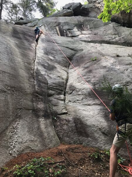 Tori gets a taste of crack climbing. Conner on belay.
