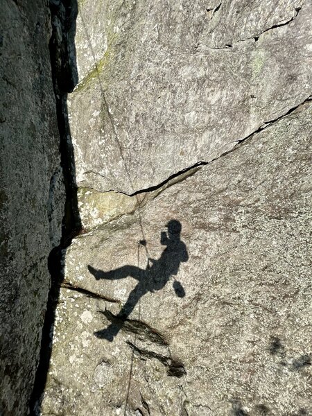 Early morning sun casting a petty cool shadow while top rope soloing