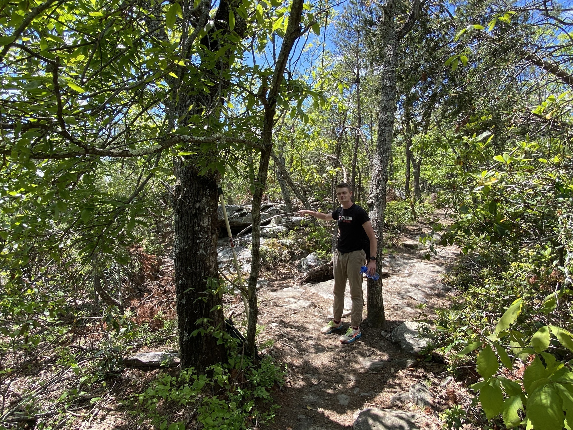 Jared Pointing the Way to the faint trail leading to the West Walls ...