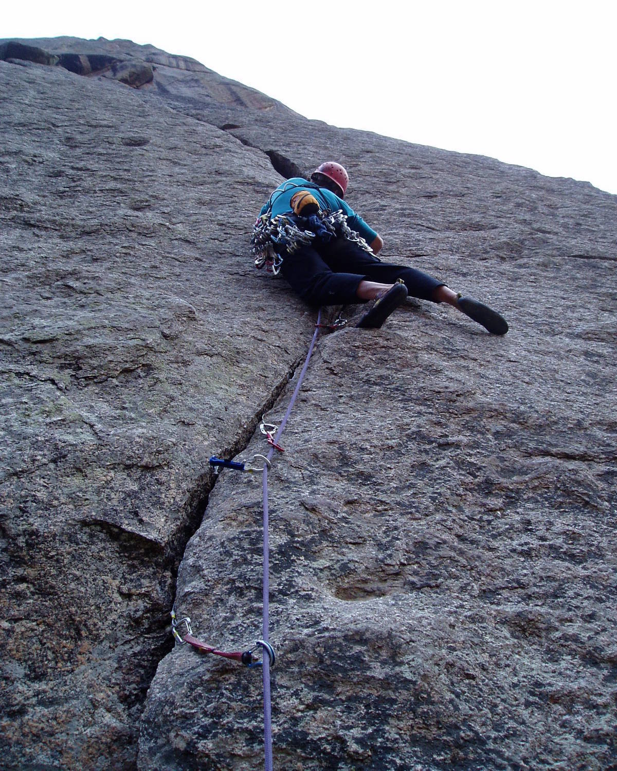 The stance after the crux. The piece at Luke's feet is a big brass that ...