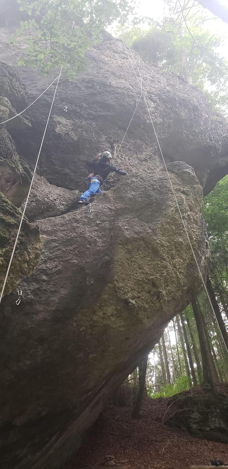 Anna Rothfuss working her way up the ramp to the crux bulge of "Team ...