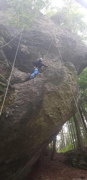 Anna Rothfuss working her way up the ramp to the crux bulge of "Team ...