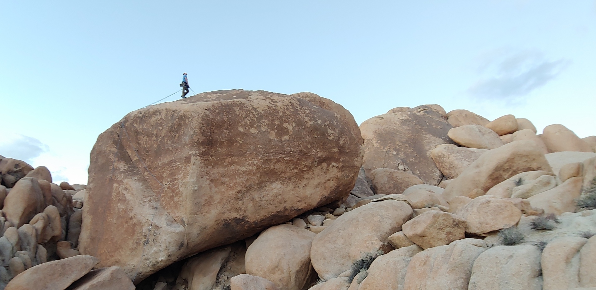 Photo of climber at top of Rachel ready to rappel down. There is a ...