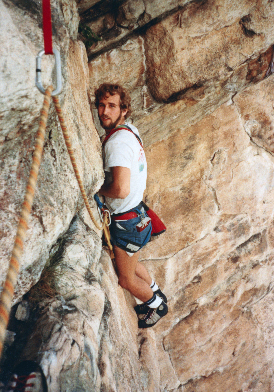 Greg K traversing into the cramped, awkward 2nd belay circa summer 1983