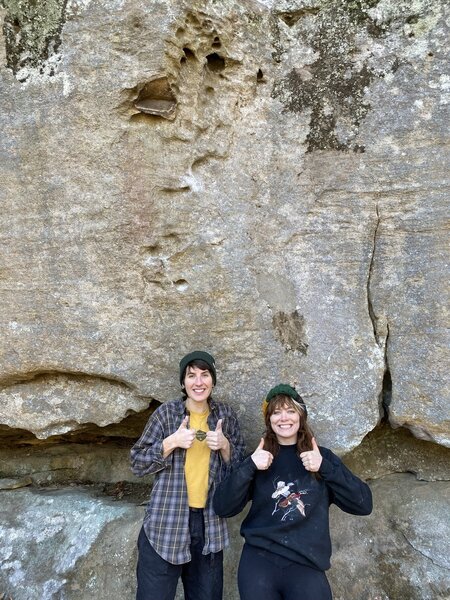 Ali and Em standing in front of mudd mantle. Start hold hidden behind ...