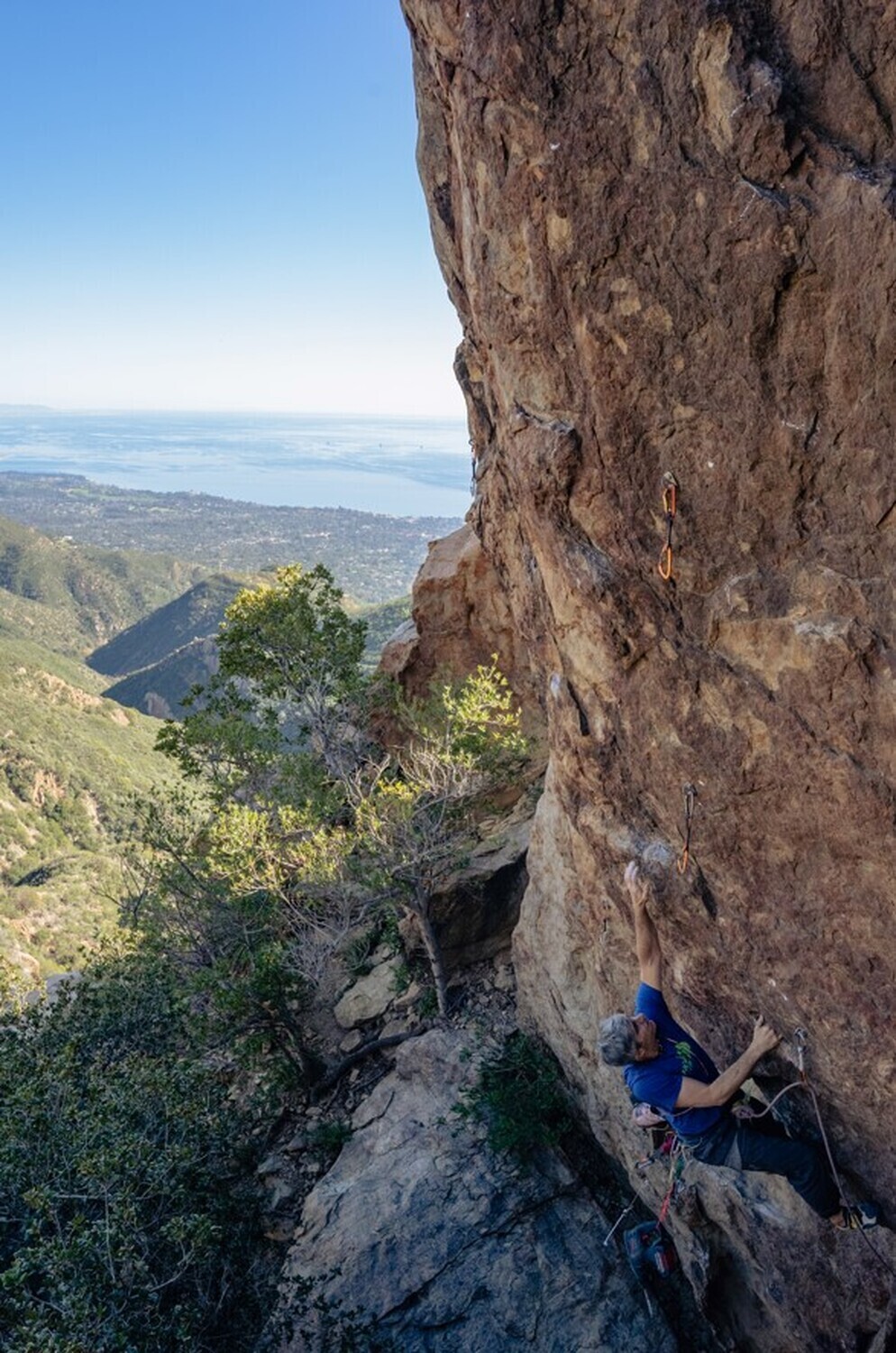 Shaun Reed climbing No Woman No Cats to place the bolt that connects ...
