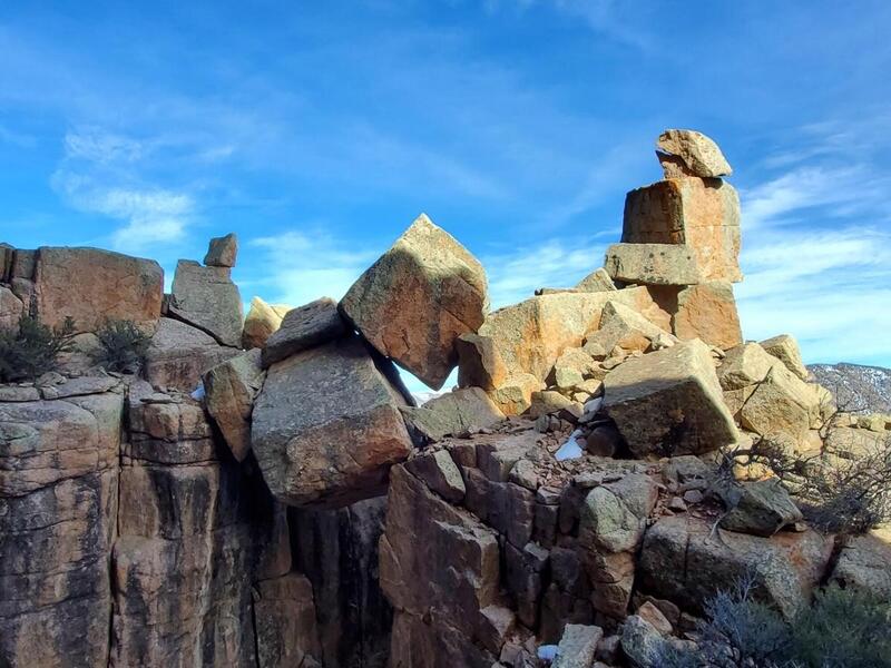 Rappels involve scrambling over the perched sun/shade Boulder this photo.
