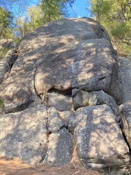 The egg looking cliff with two routes on it.