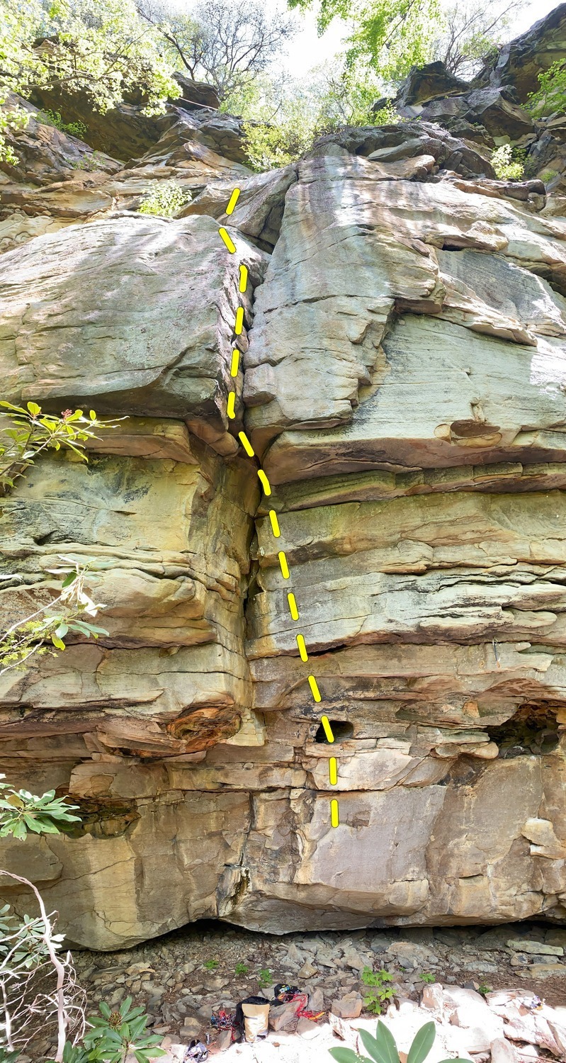 Route climbs the dihedral in center frame starting just under the hueco.