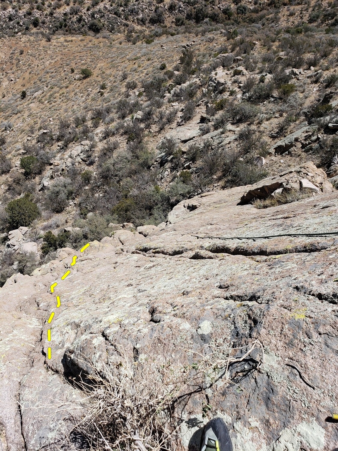 Looking down from the belay - line ends at the top of the roof
