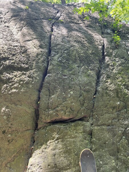 Parallel cracks on the right side of the slab