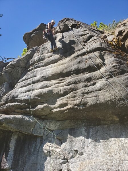 Getting lowered after the first ascent. The route is short, but longer ...