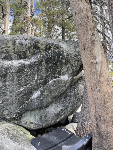 view of the south side of the boulder with the normal finish in yellow ...