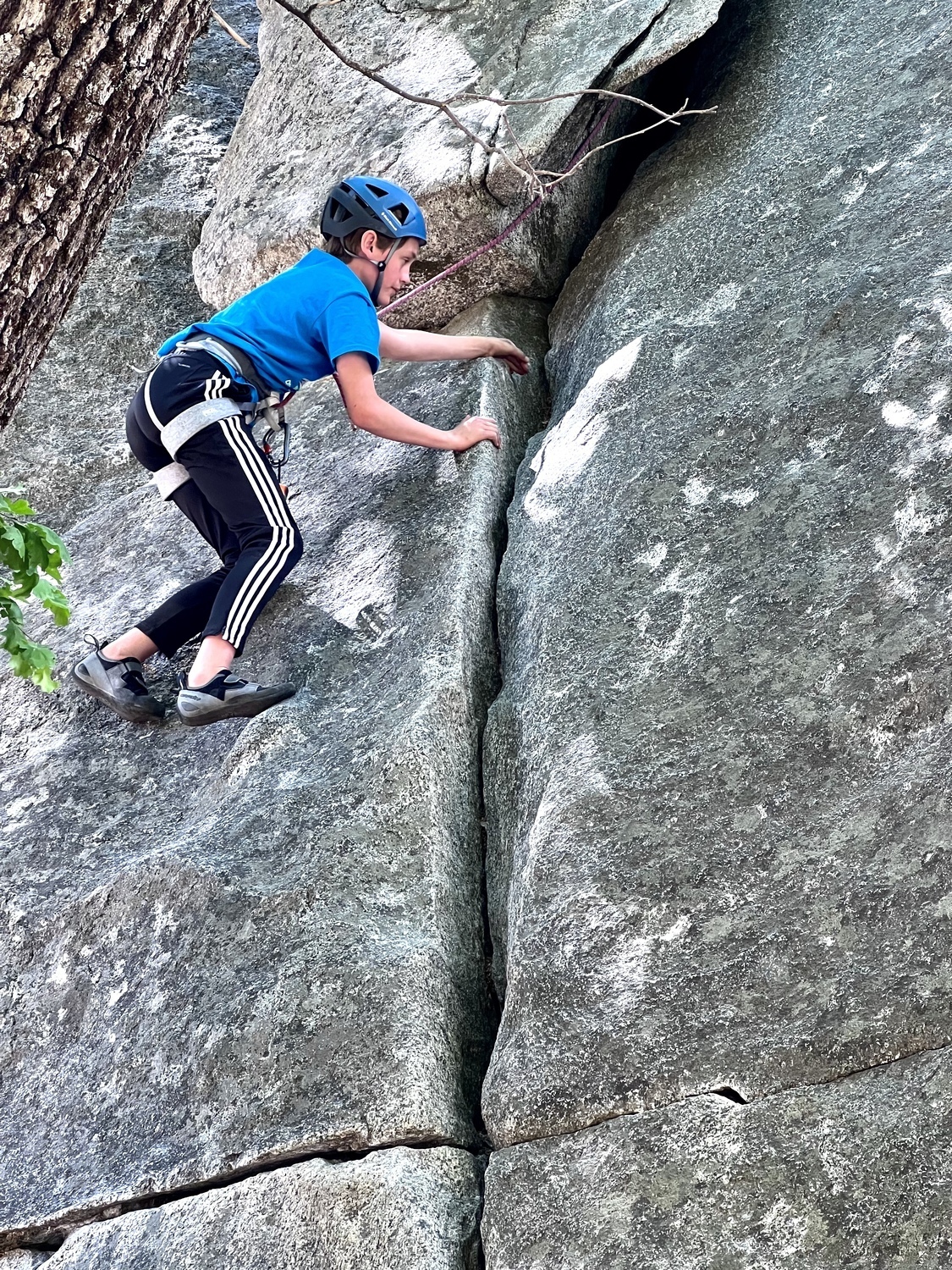 Picture of me climbing the route on the crack section before the flake.