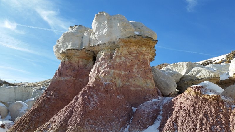 Sandstone capped spires with clay containing oxidized iron- Paint Mines ...