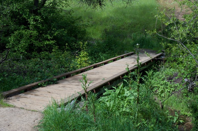 The bridge crossing the small creek that runs through the ravine.