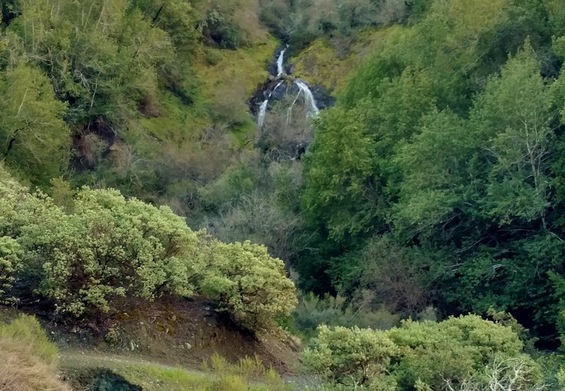 A waterfall splits as it tumbles down a rock face along the Limekiln ...