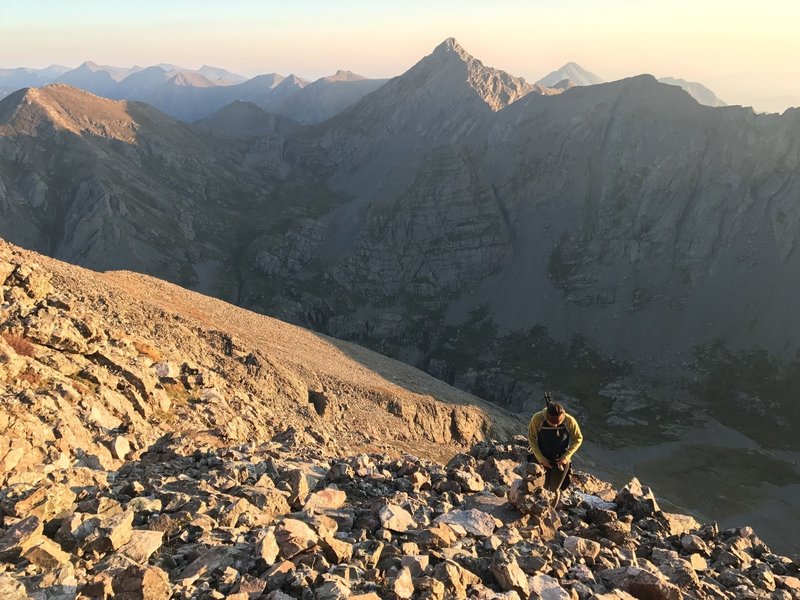 With loose scree along the North Slope ascent of Challenger Point ...