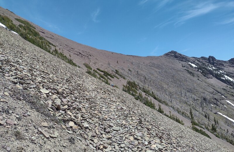 The trail can faintly be seen (up the center) as it traverses shale and ...