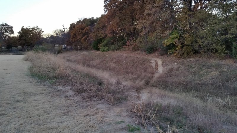 A ditch crossing off the side of the trail.
