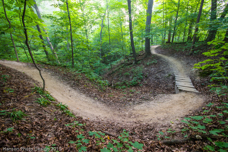 A small trail bridge spans a gulley on the South Loop while the trail ...