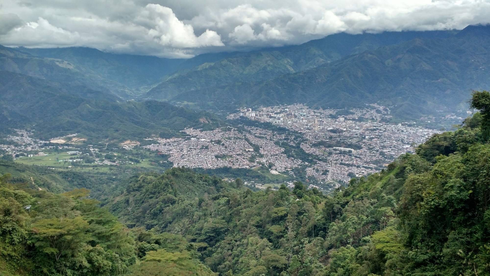 Ibague city view. In the back is the road through the mountain to ...