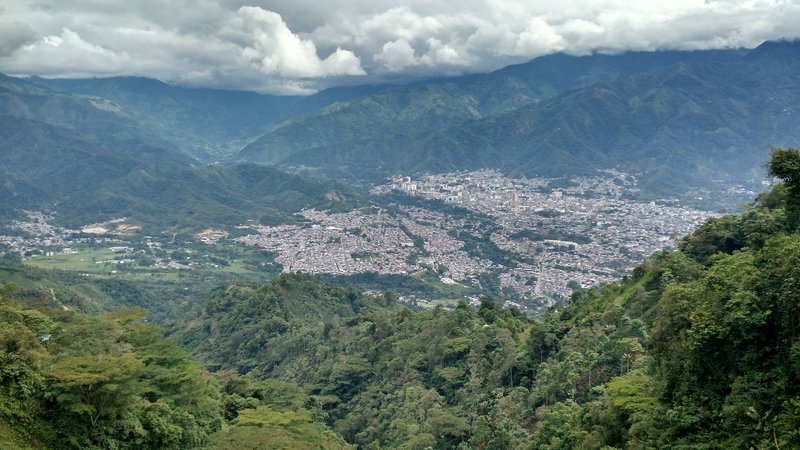 Ibague city view. In the back is the road through the mountain to ...