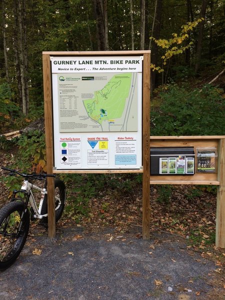 Trail map sign near entrance at Gurney. Brochures and trail maps of ...
